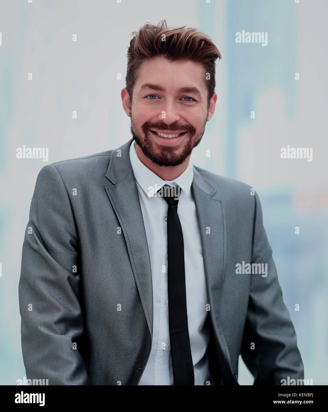 Male casual office worker smiling in office Stock Photo - Alamy