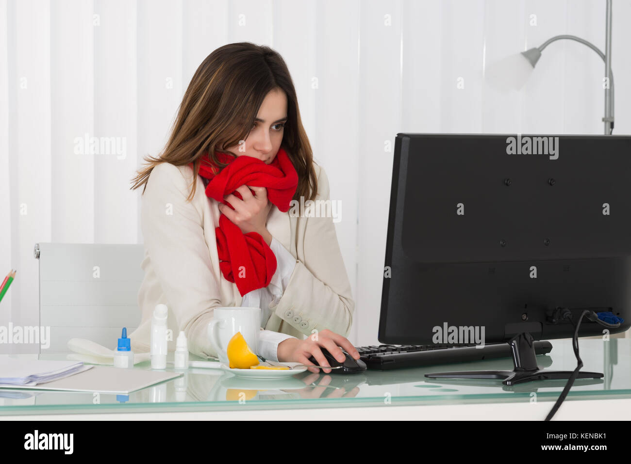 Sick Young Businesswoman Working On Computer In Office Stock Photo - Alamy