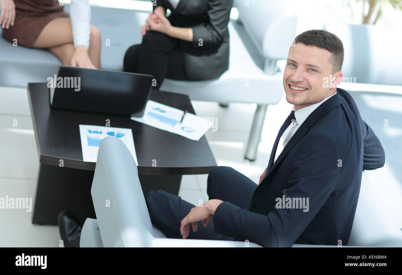 Group of young business people gathered together discussing creative ...