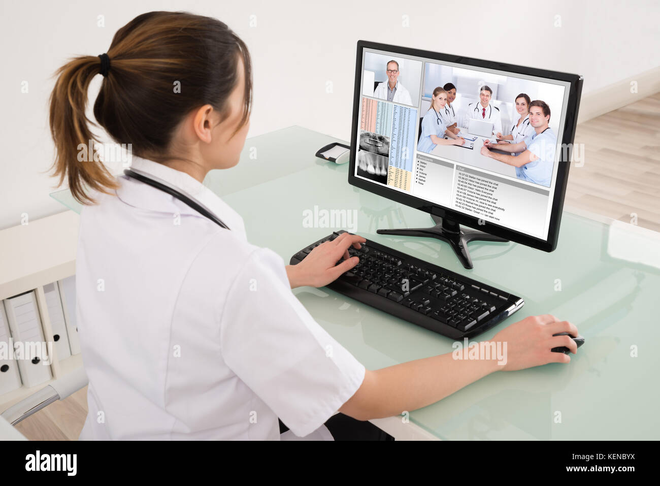 Young Female Doctor Video Conferencing With Medical Team On Digital ...