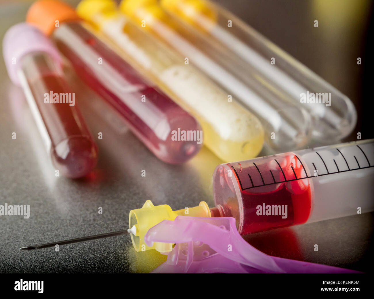 Several vials and syringe in laboratory, conceptual image Stock Photo - Alamy