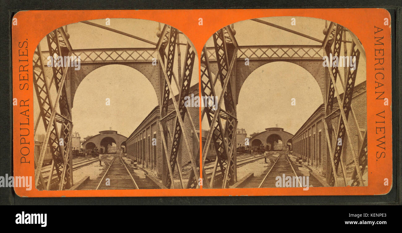 This photograph, taken from an R.R. bridge, depicts a railroad depot ...