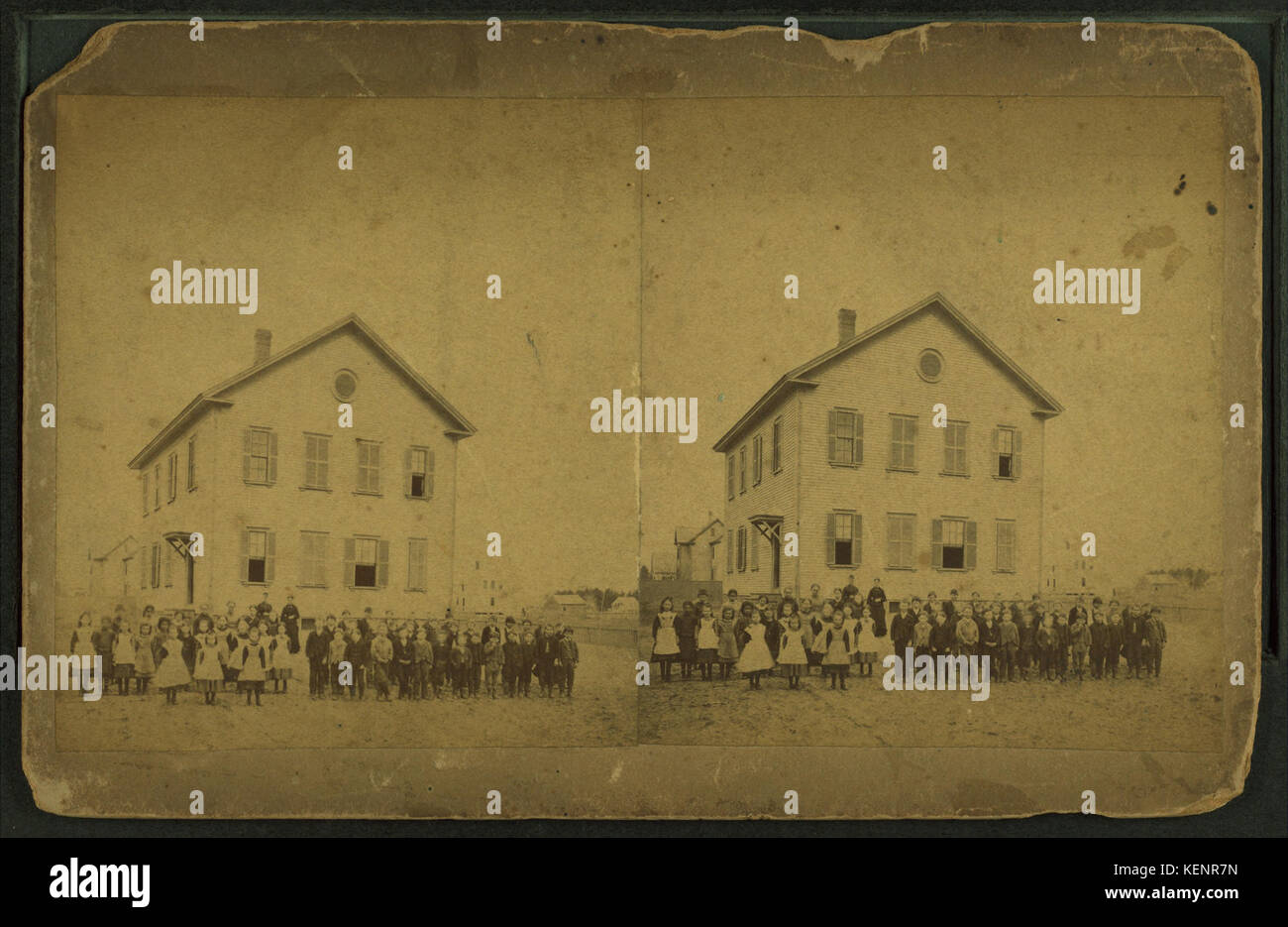 View of unidentified students and teachers in front of school, by Alden ...
