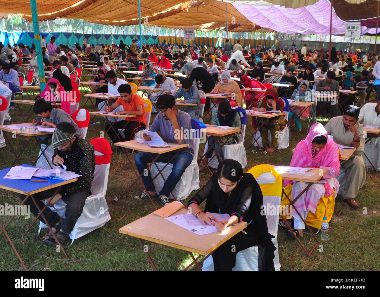 Students are busy in solving questions paper during pre- entry medical ...
