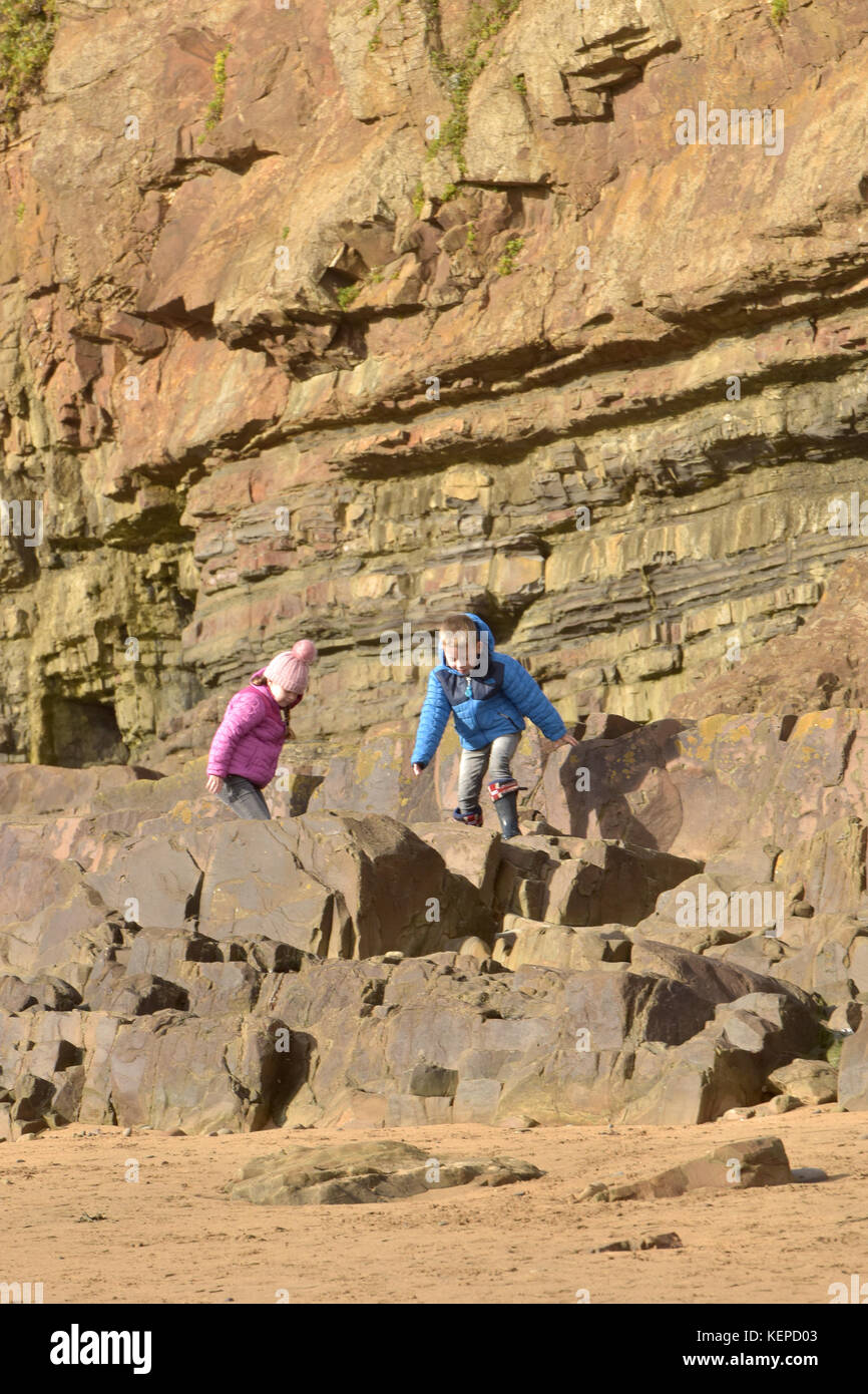 Two Children Playing On Rocks High Resolution Stock Photography and ...