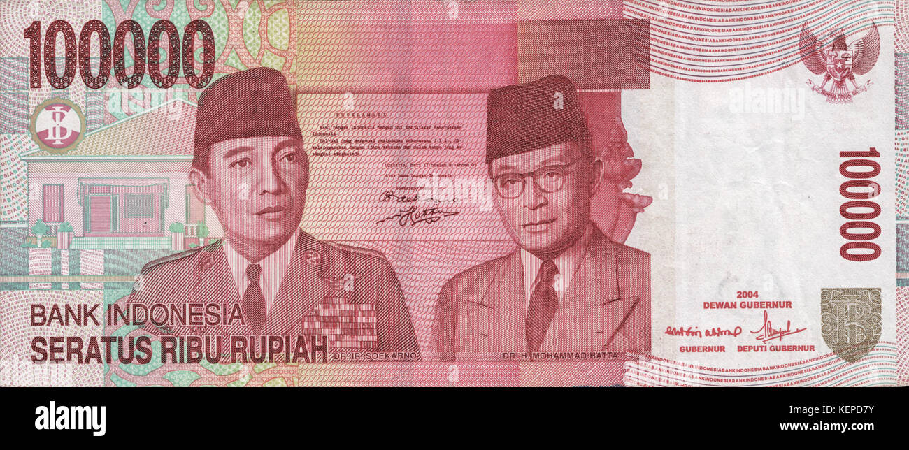 The 100,000 rupiah bill, issued in 2004 by Indonesia, features images ...