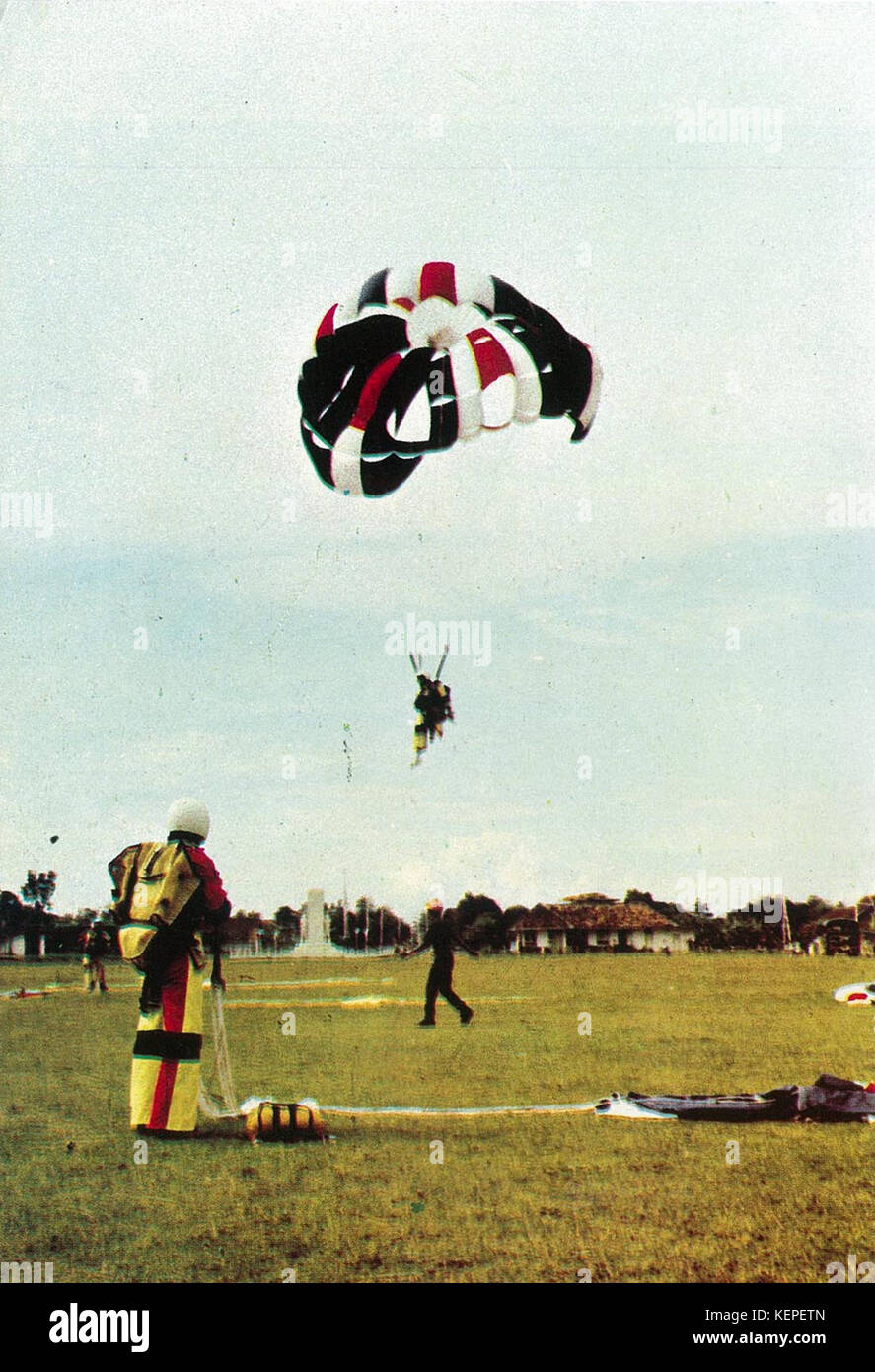 This image depicts a parachuting exercise by the Indonesian Mobile ...