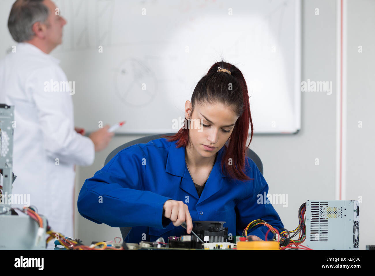 pretty student during electronics class Stock Photo - Alamy