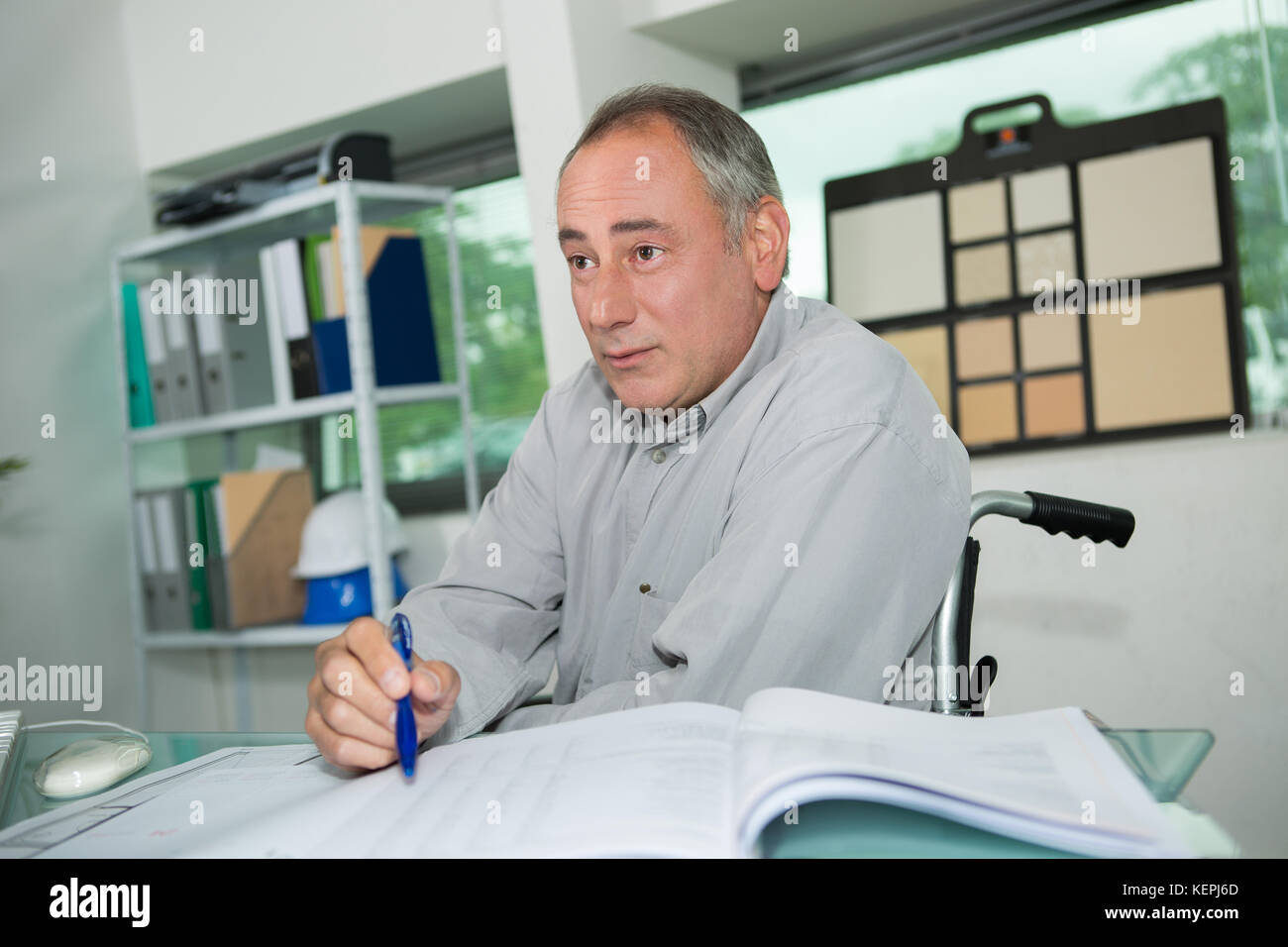 disabled business man in wheelchair working Stock Photo - Alamy