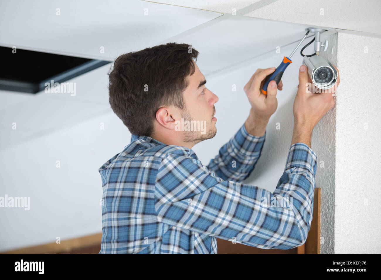 professional cctv technician working Stock Photo - Alamy