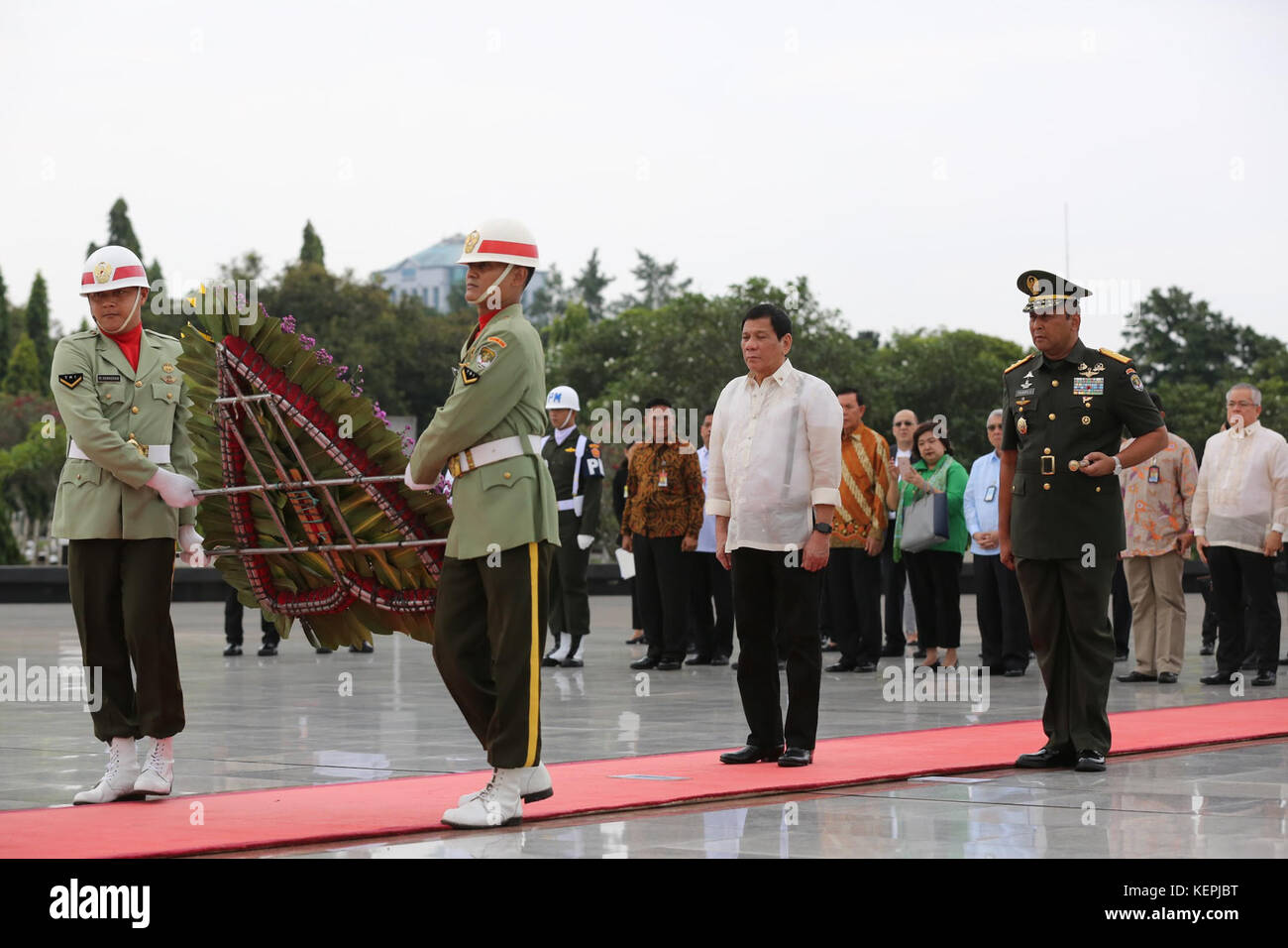 President Rodrigo Dutete is assisted by Indonesian officials during a ...