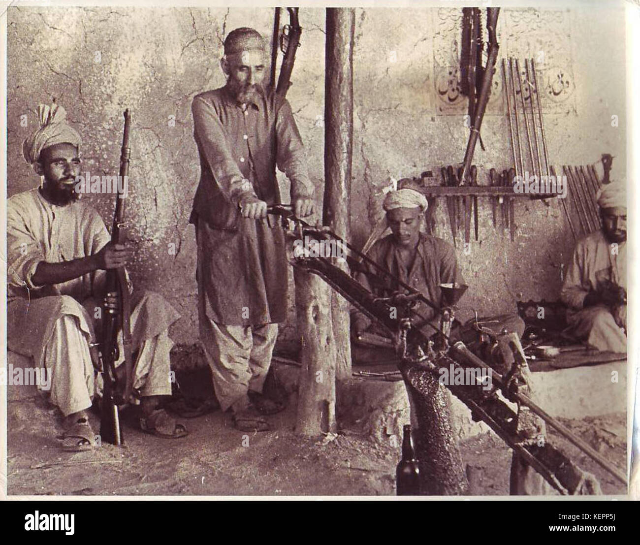 Afridi tribesmen making rifles in a native rifle factory Stock Photo ...