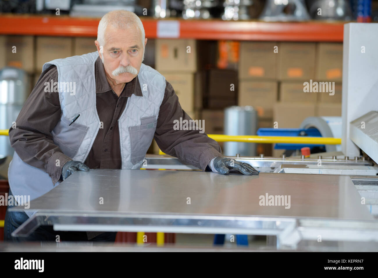 factory man worker holding metal sheet in workshop Stock Photo - Alamy