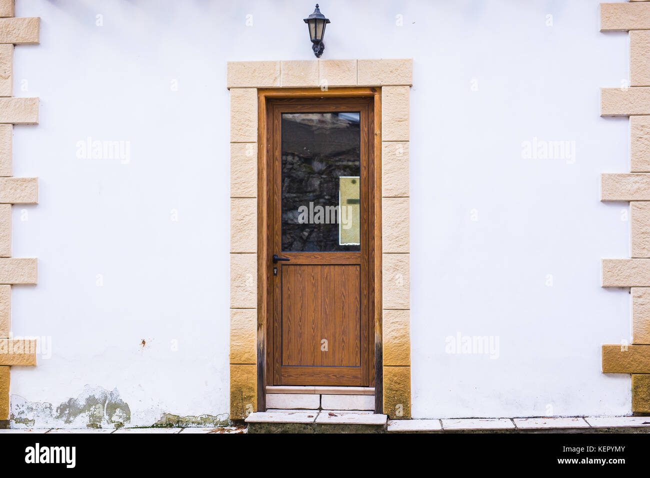 Close up of a front door with square decorative window Stock Photo - Alamy