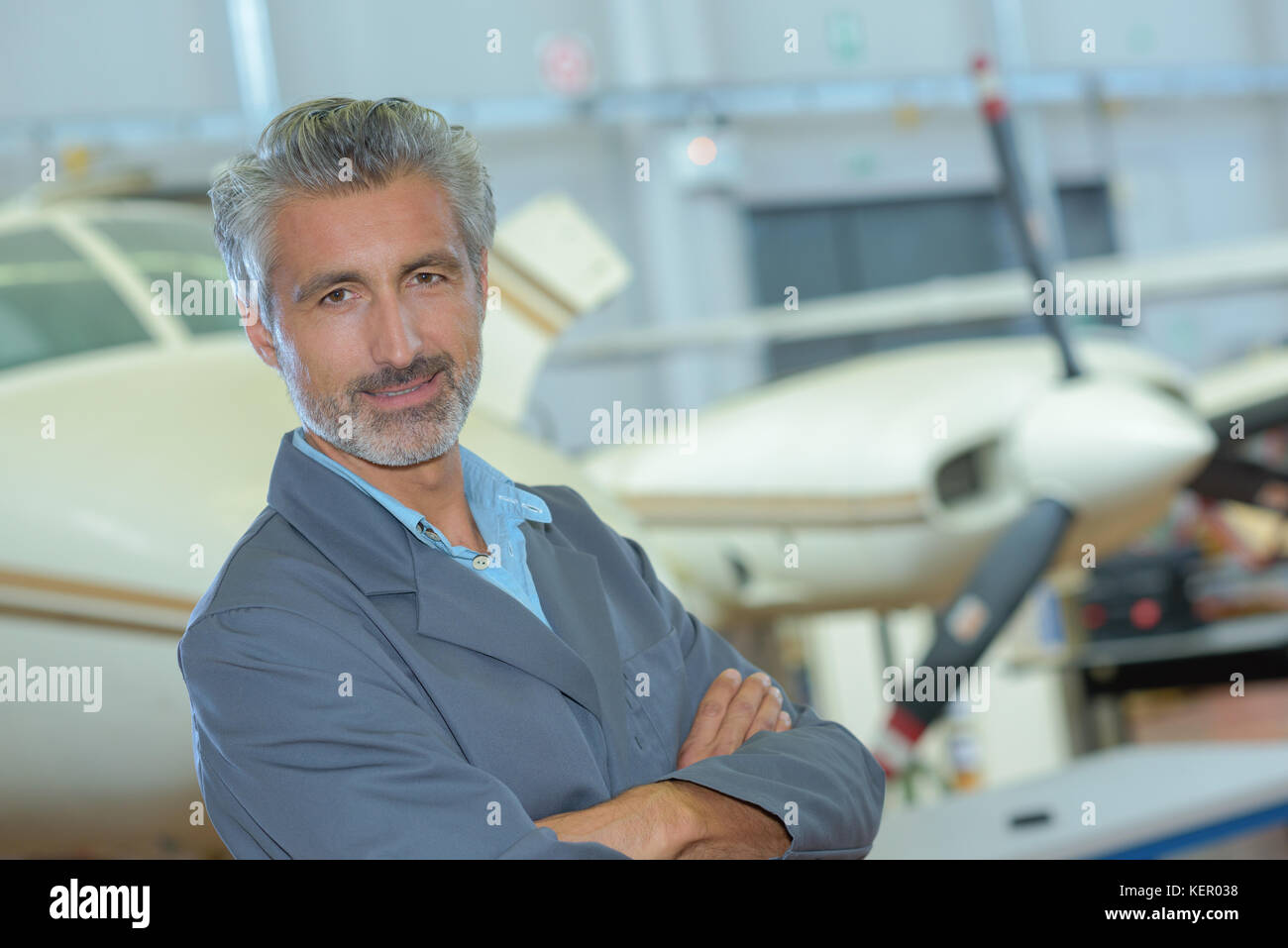 pilot posing in front of planes Stock Photo - Alamy