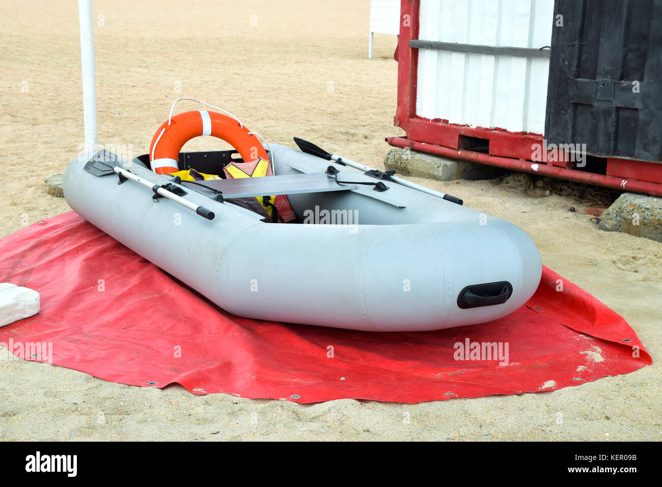 Inflatable Rescue Boat. Gray inflatable boat on the beach in the sand ...
