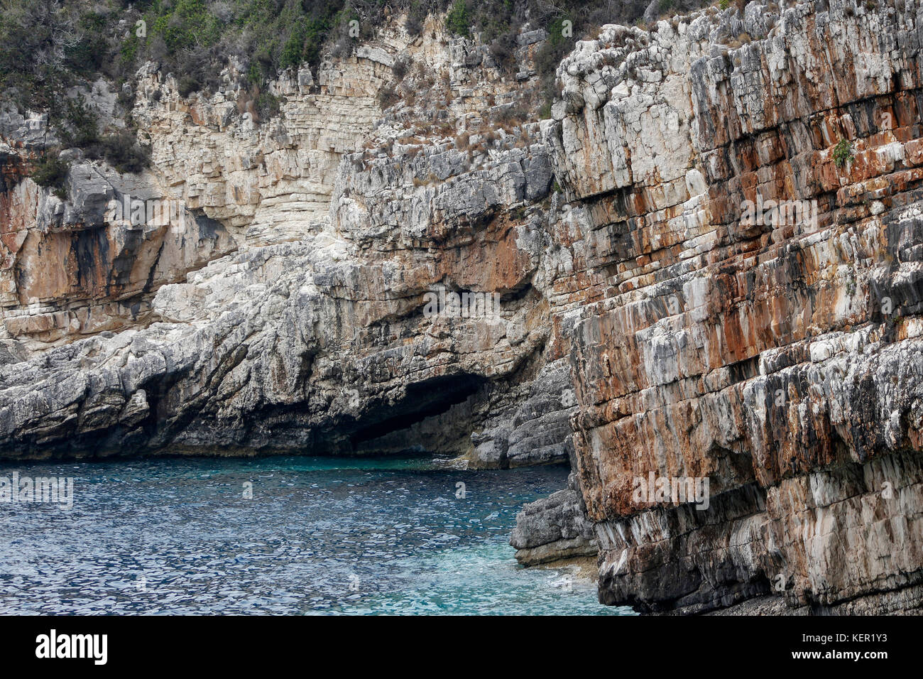Rock massif with a caves over the Ionian Sea, Greece Stock Photo - Alamy