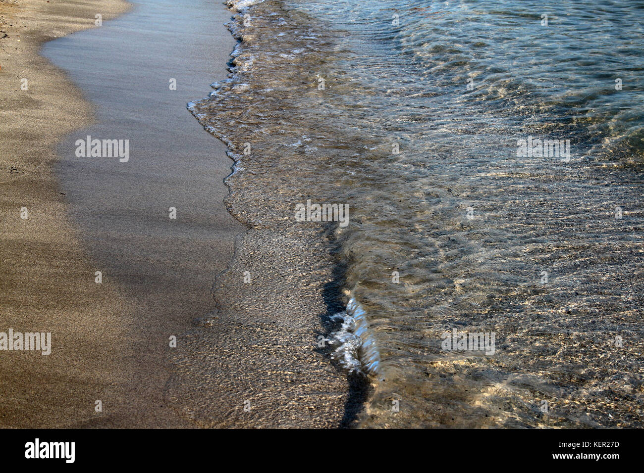 Between the sand and the sea Stock Photo - Alamy