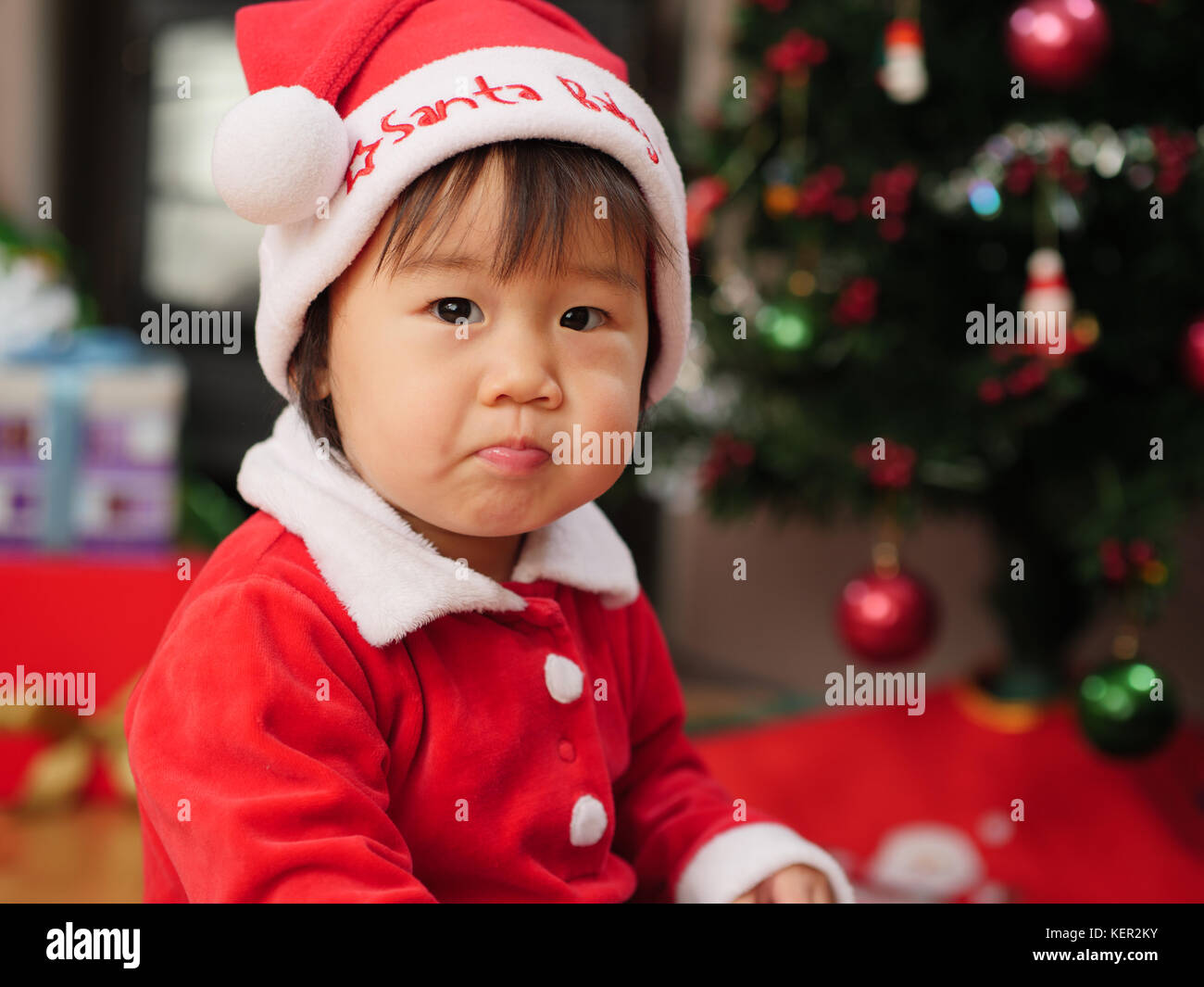 Happy santa baby girl Stock Photo - Alamy