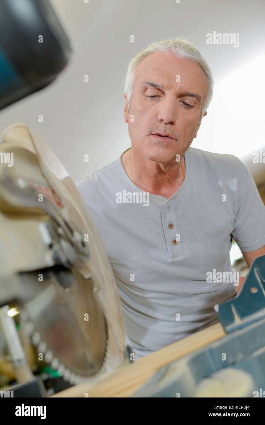 Man using buzz saw hi-res stock photography and images - Alamy