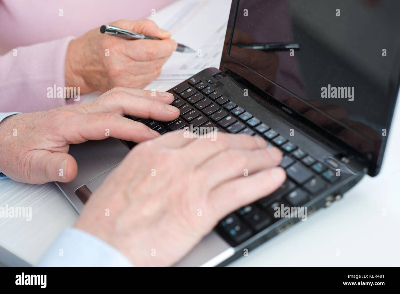 senior persons hands typing on computer Stock Photo - Alamy