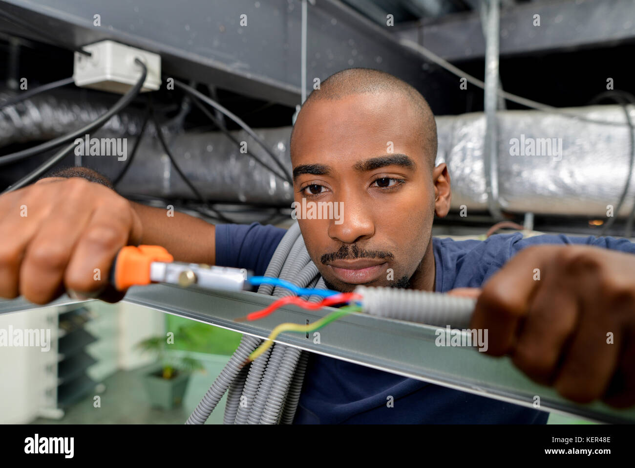 Electrician likes his job Stock Photo - Alamy