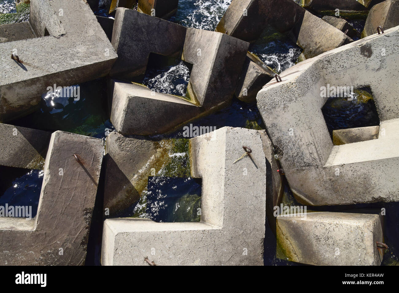 Breakwater blocks in the port. Breakwater of the rectangular stone ...