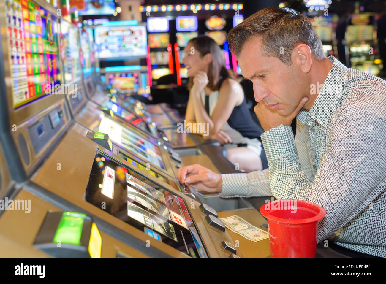 playing on the slot machines Stock Photo - Alamy