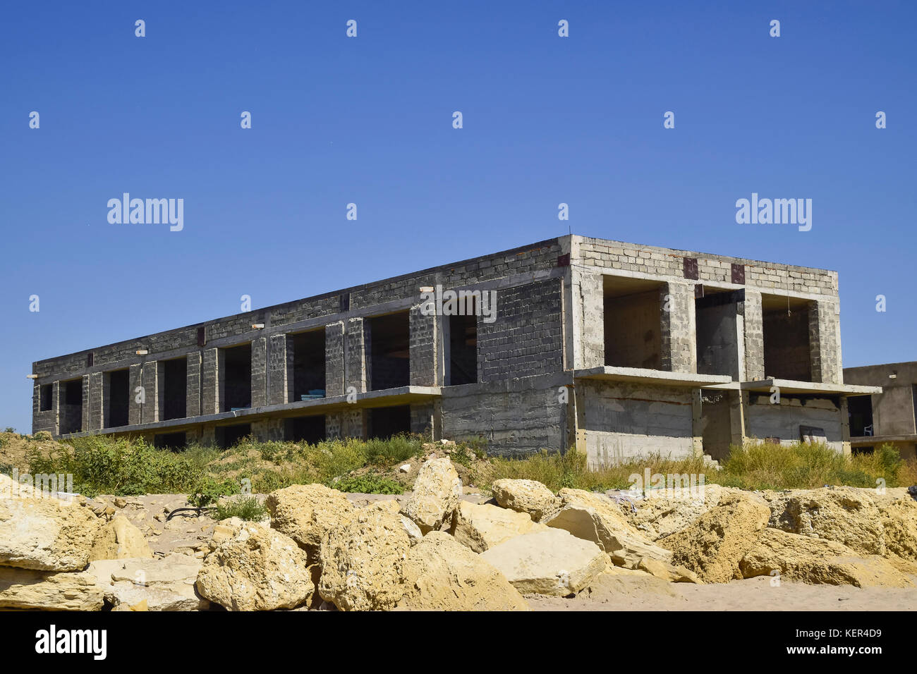 Unfinished building of gray block. Home construction Stock Photo - Alamy