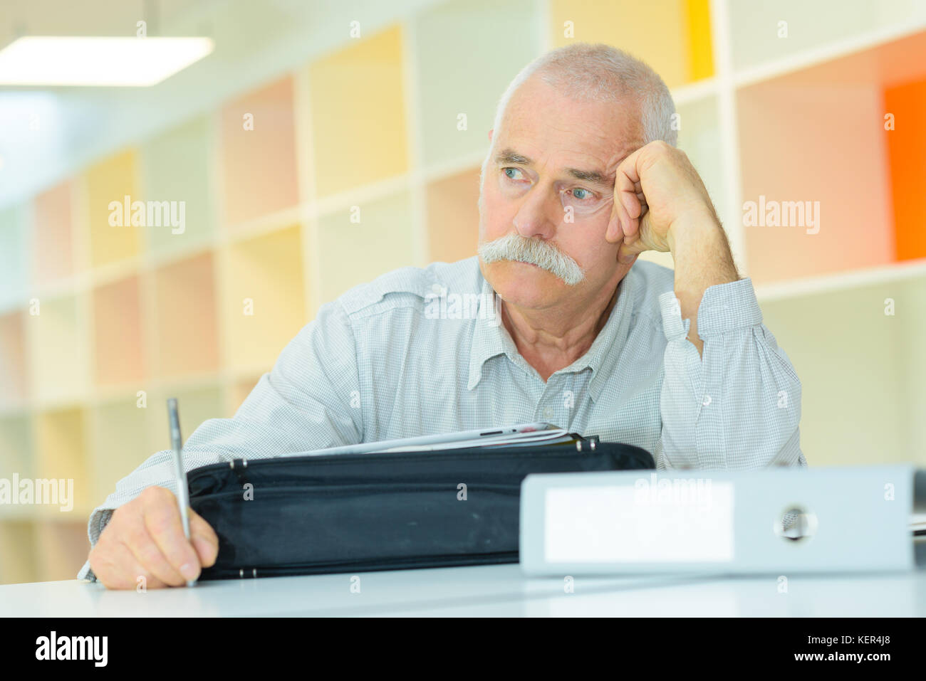 worried office worker analyzing his career path Stock Photo - Alamy