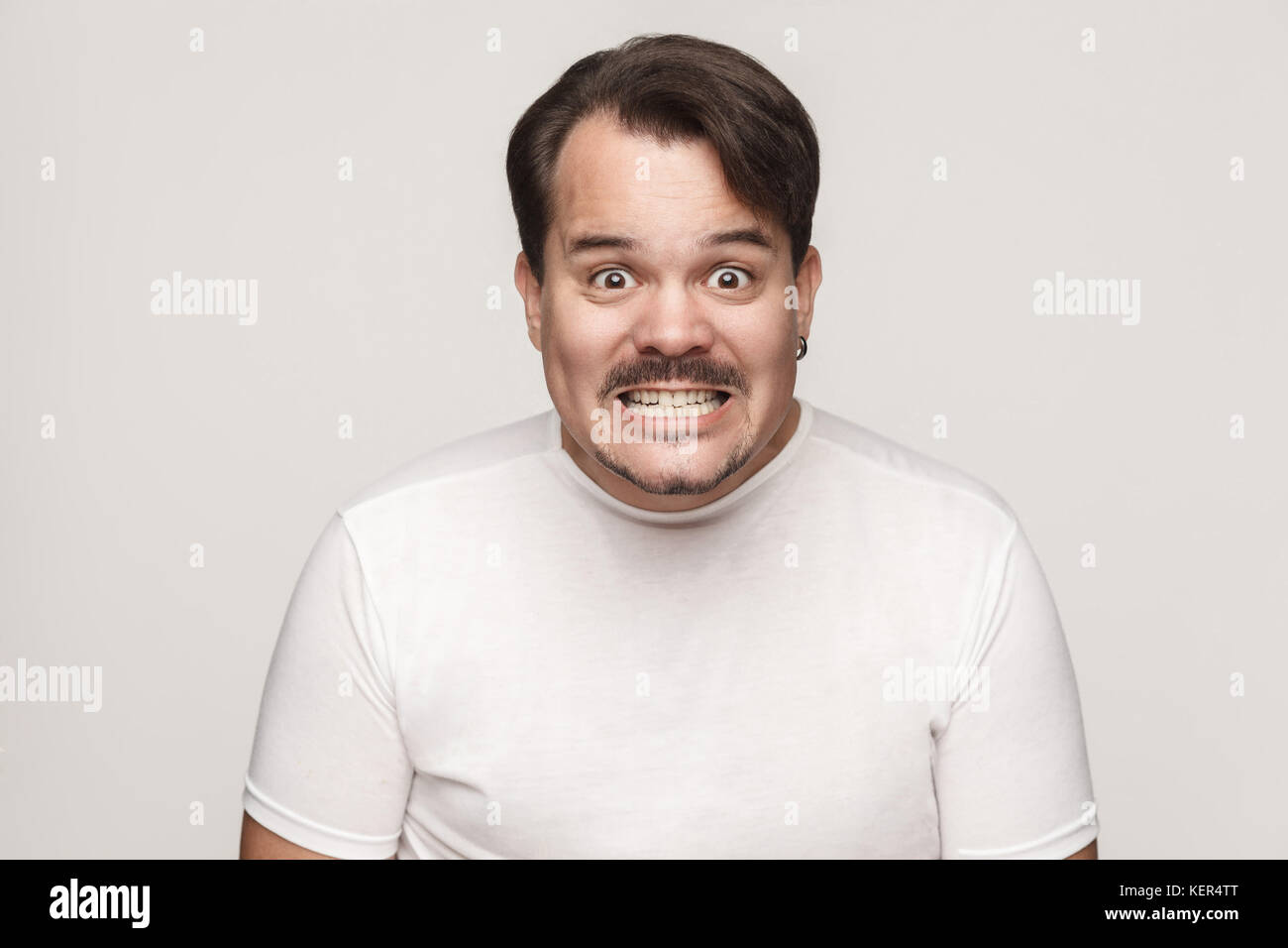 Agressive man shout at camera. Wild emotions and feelings. Isolated on ...