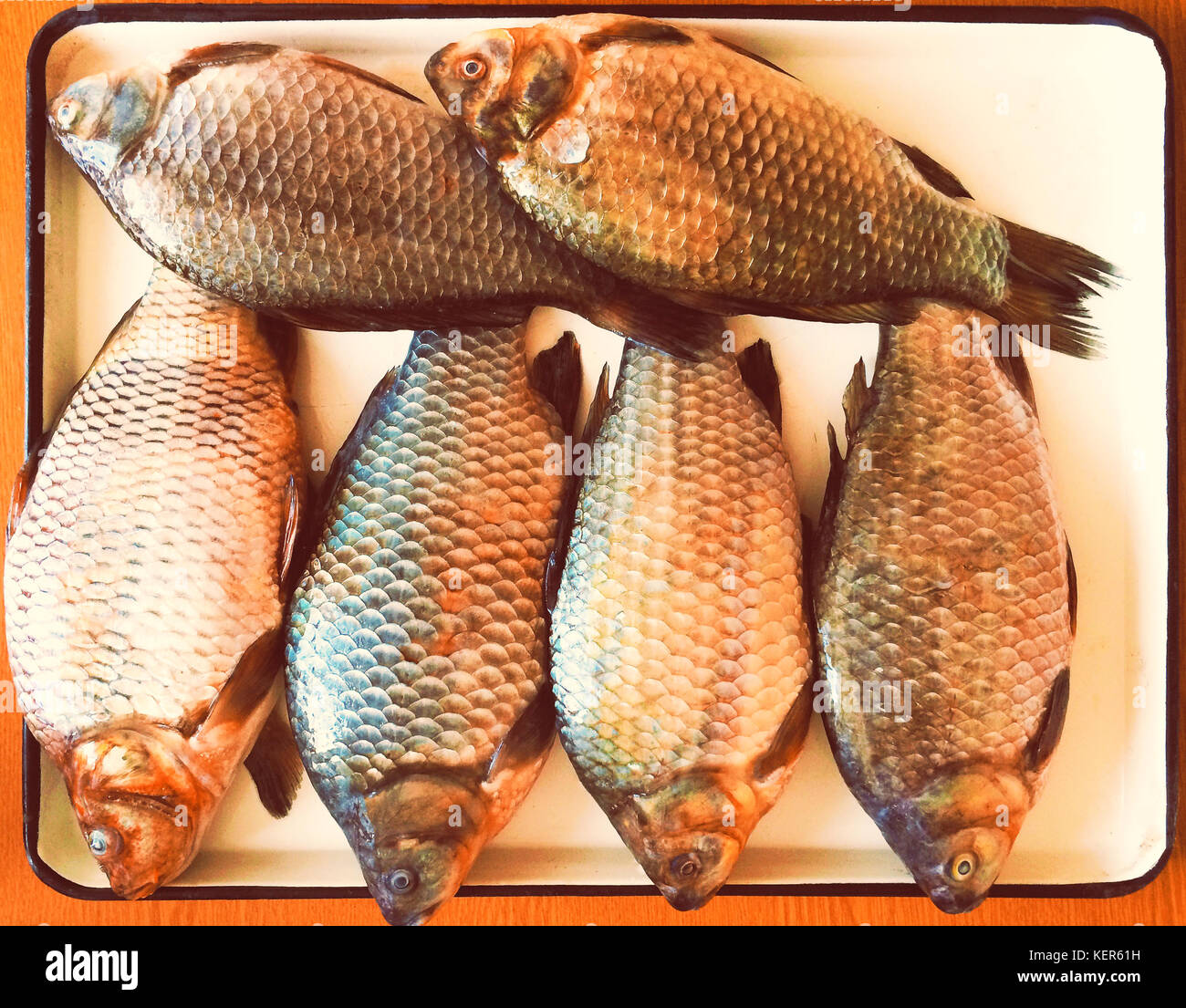 Six fresh fish lying accurately in the dish. Top view Stock Photo - Alamy