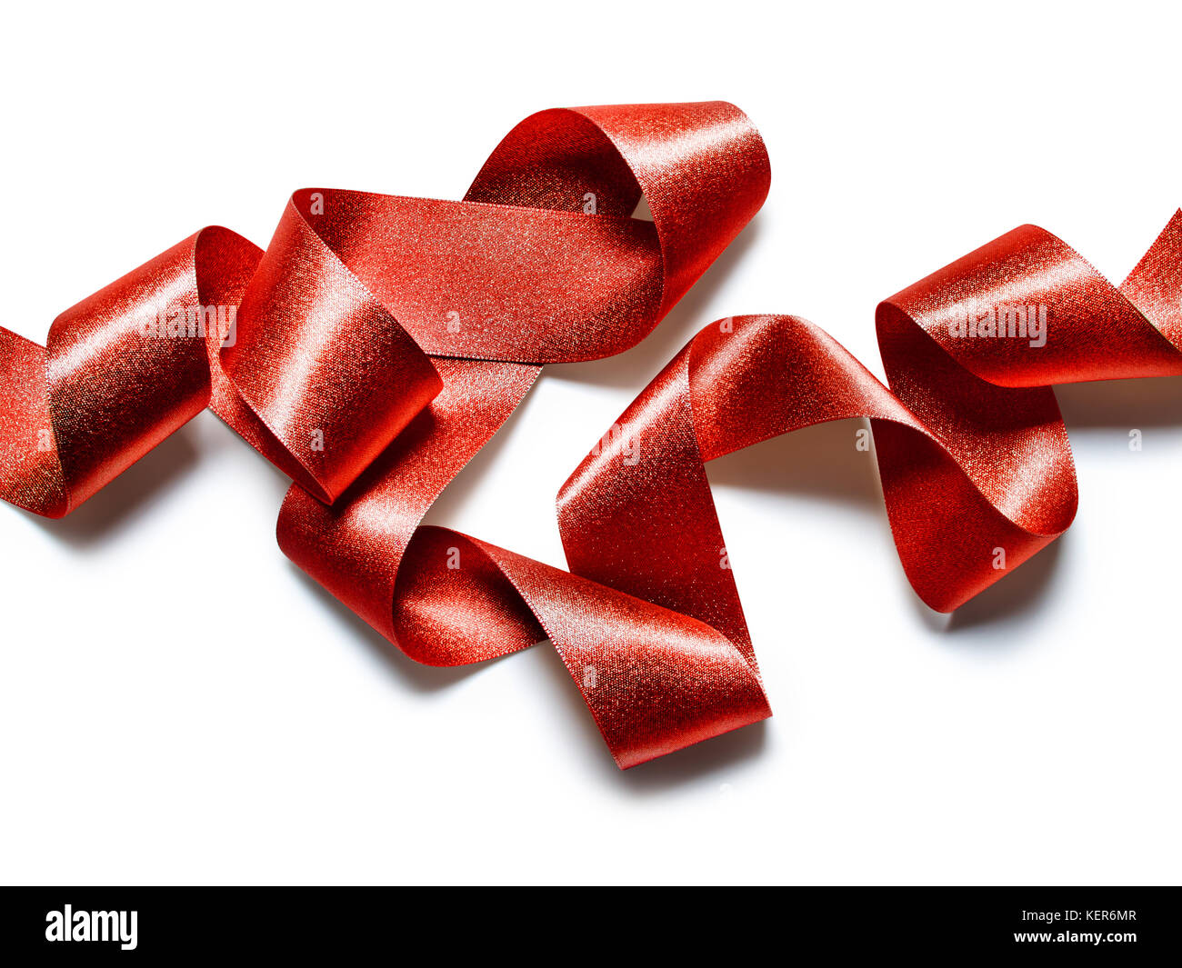 Close up of red metallic ribbon isolated on white background Stock ...