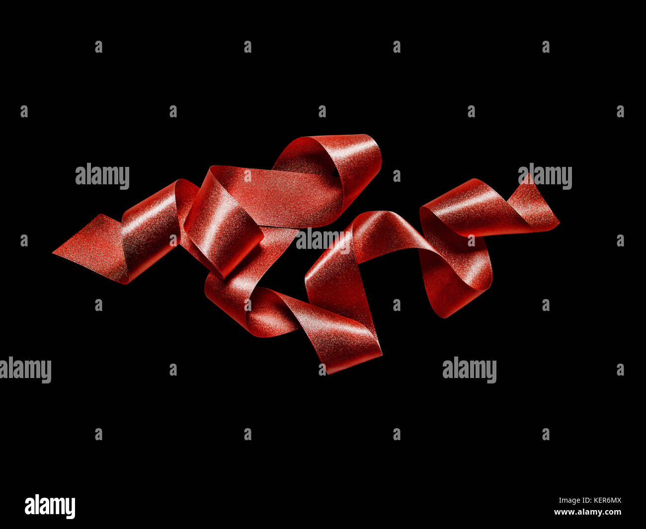 Red metallic ribbon isolated on black background Stock Photo - Alamy