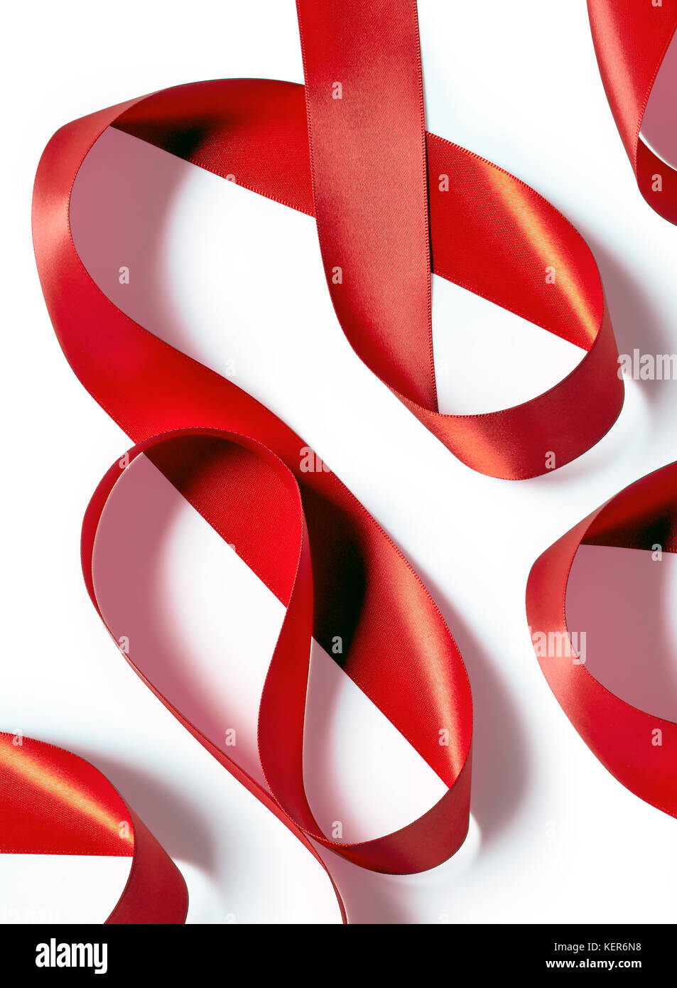Red silk or satin ribbon abstraction isolated on white background Stock ...