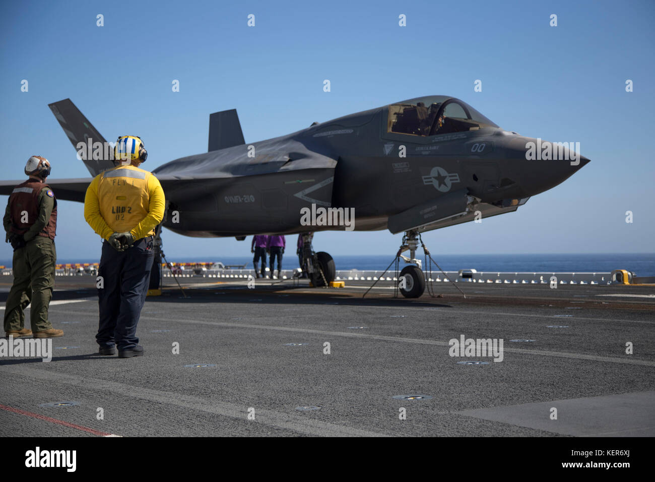 U.S. Navy Sailors and Marines assist F-35B Lightning II pilots Stock ...