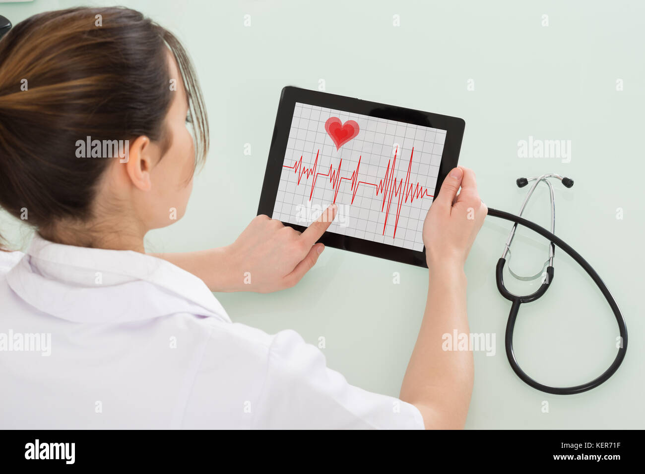 Female cardiologist analyzing heartbeat hi-res stock photography and ...