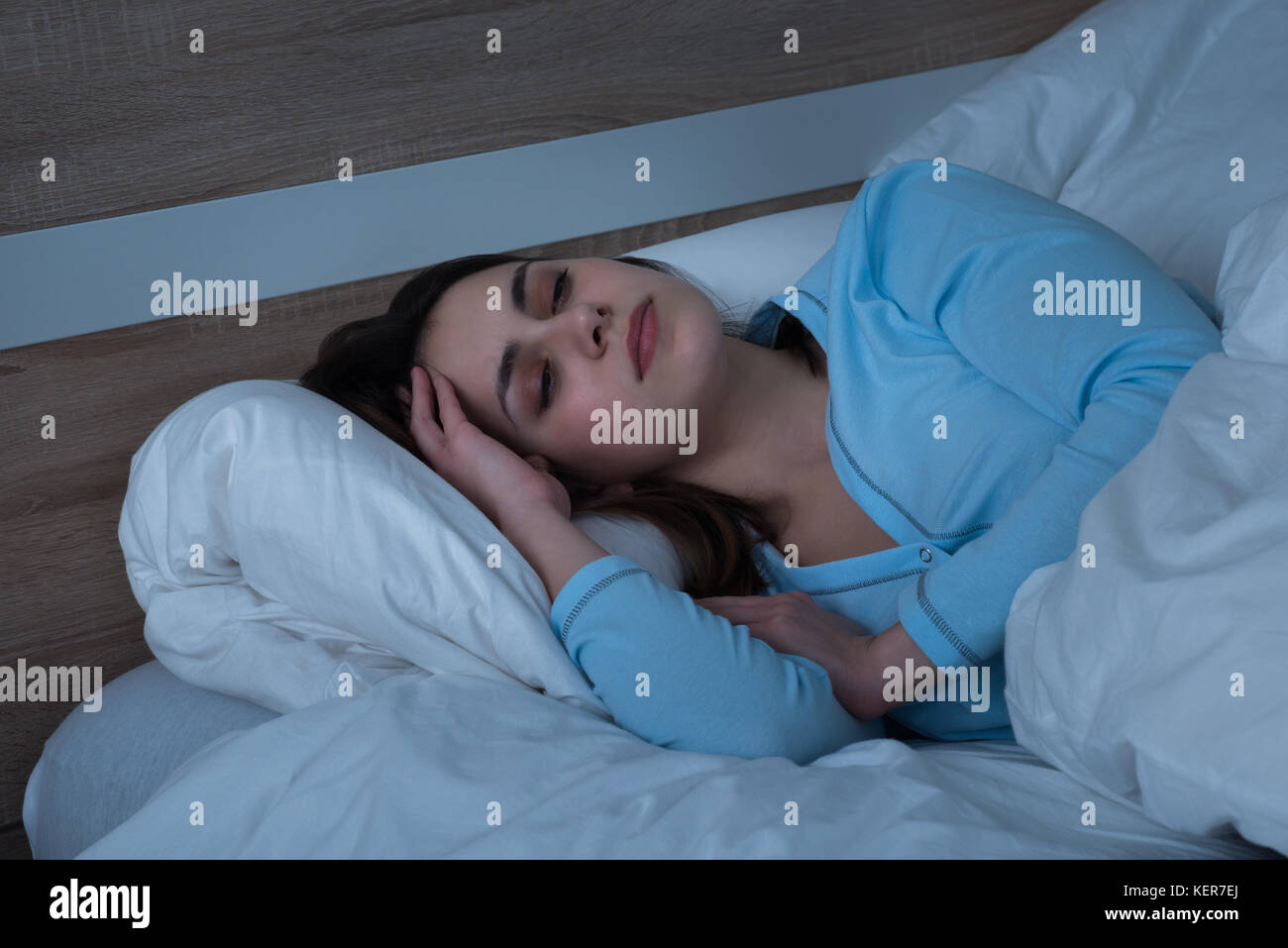 Woman Suffering From Insomnia Lying On Bed Stock Photo - Alamy