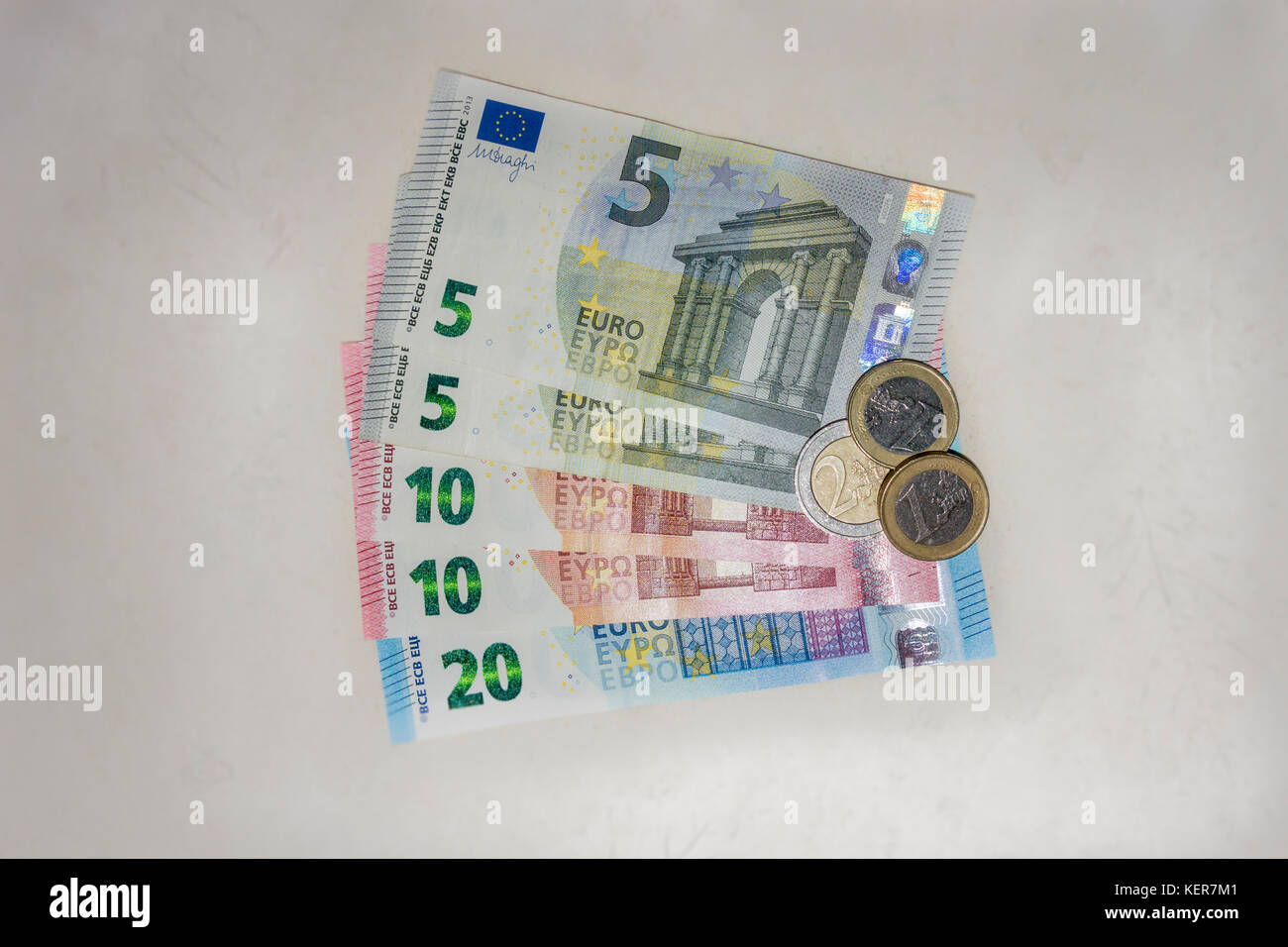 A selection of euro bank notes and coins Stock Photo - Alamy