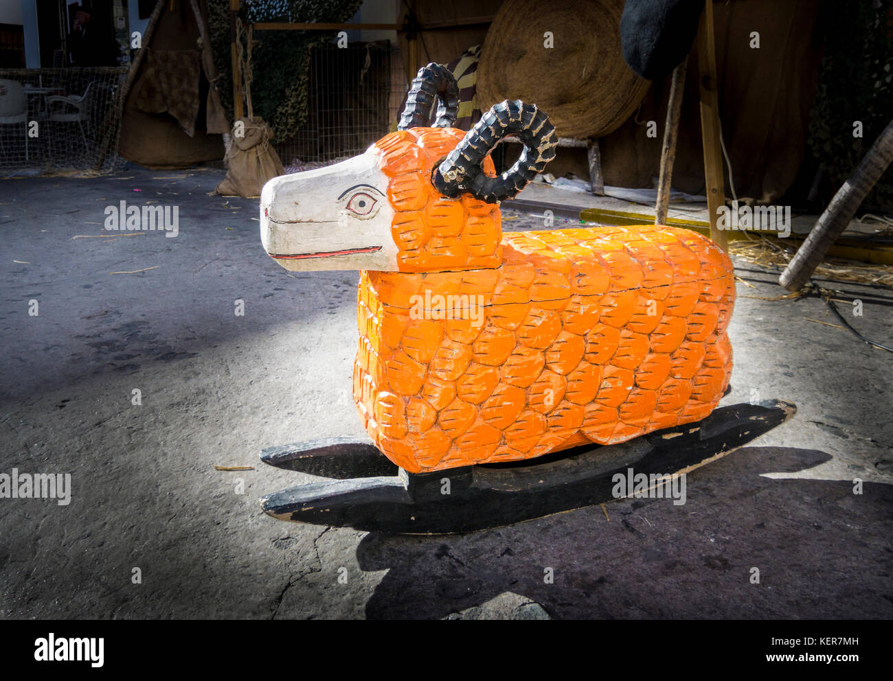 Orange wooden rocking sheep, childs toy Stock Photo - Alamy