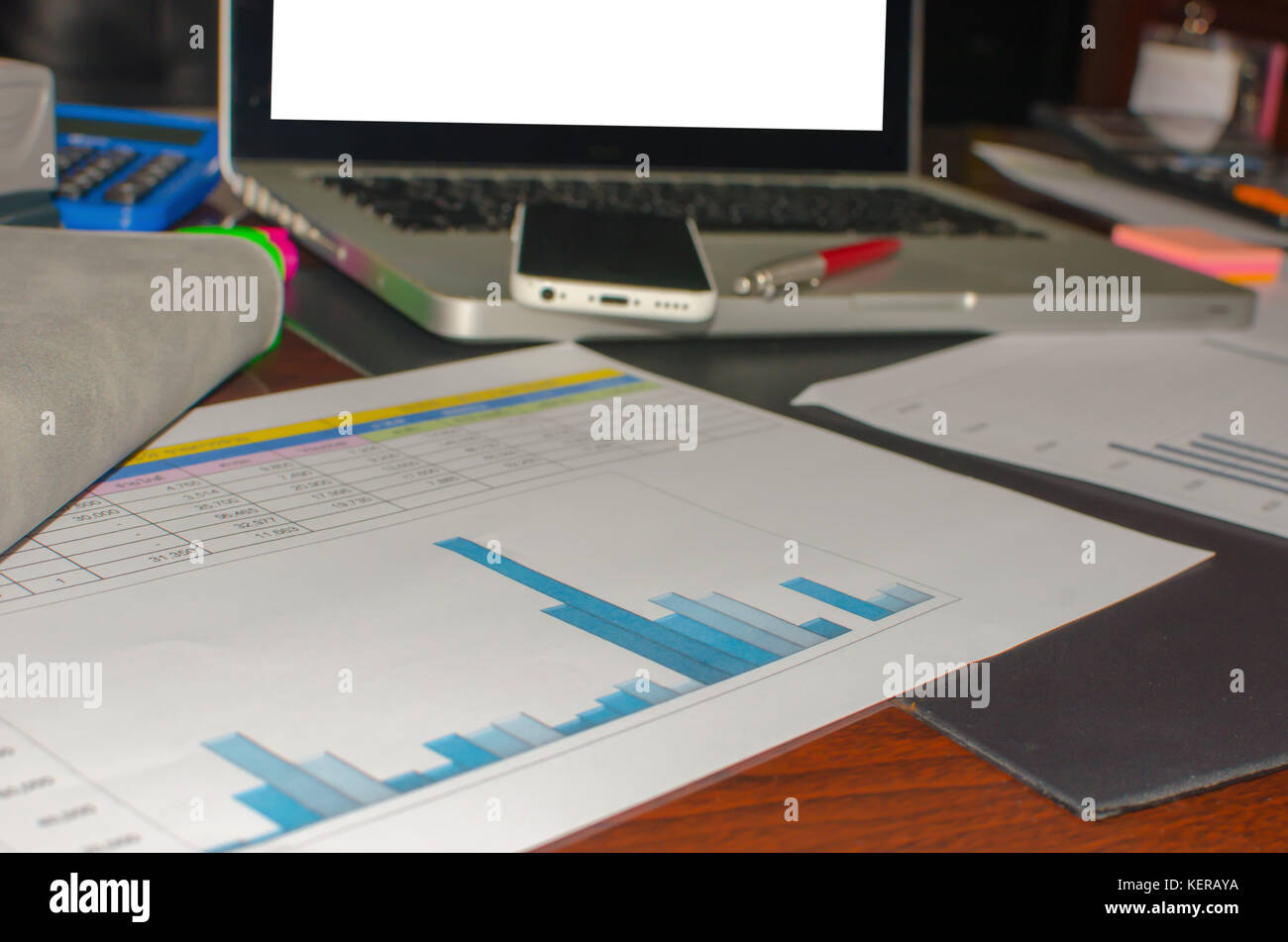 Financial paper charts and graphs on the table Stock Photo - Alamy