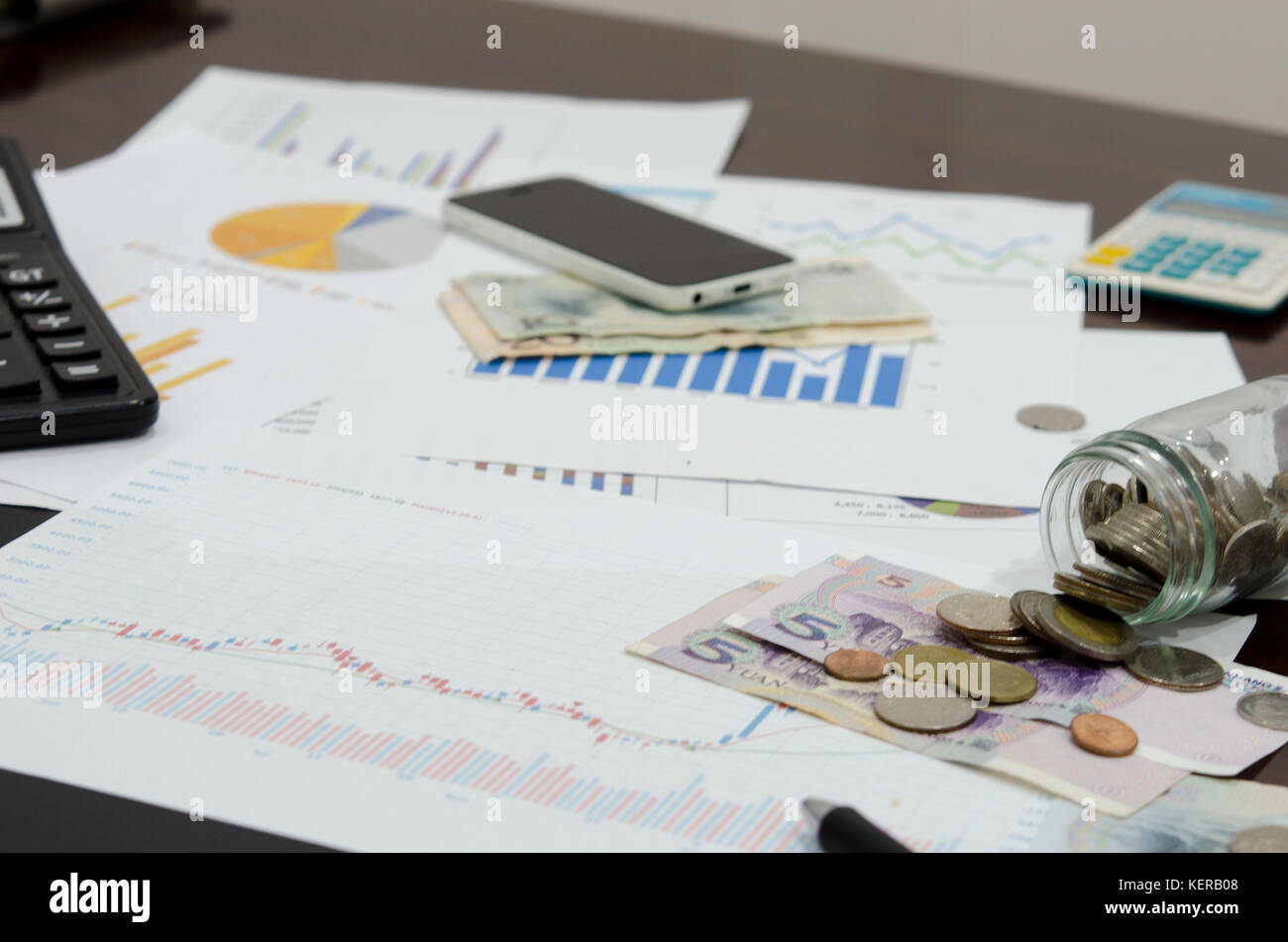 financial chart and coins on paper Stock Photo - Alamy