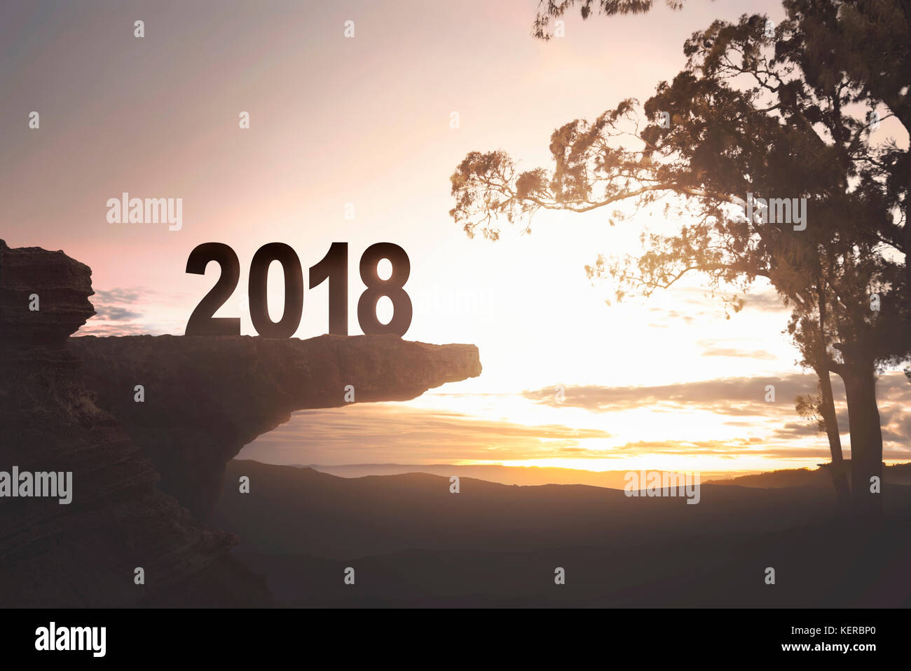 2018 number standing on the edge of cliff with trees at sunset ...