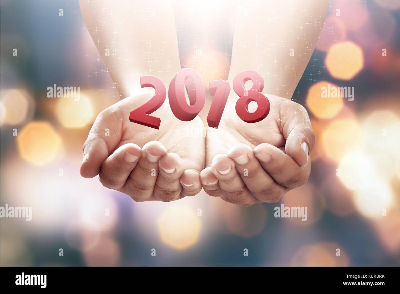 Human hand holding 2018 number with blur background Stock Photo - Alamy