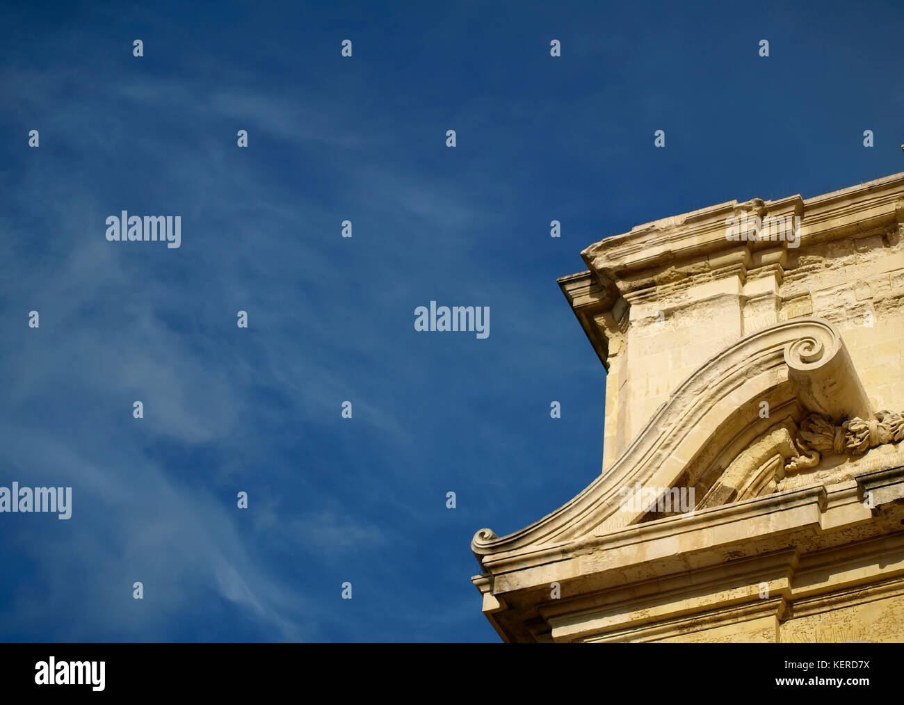 A medieval limestone facade in traditional Gothic style in Mdina on the ...