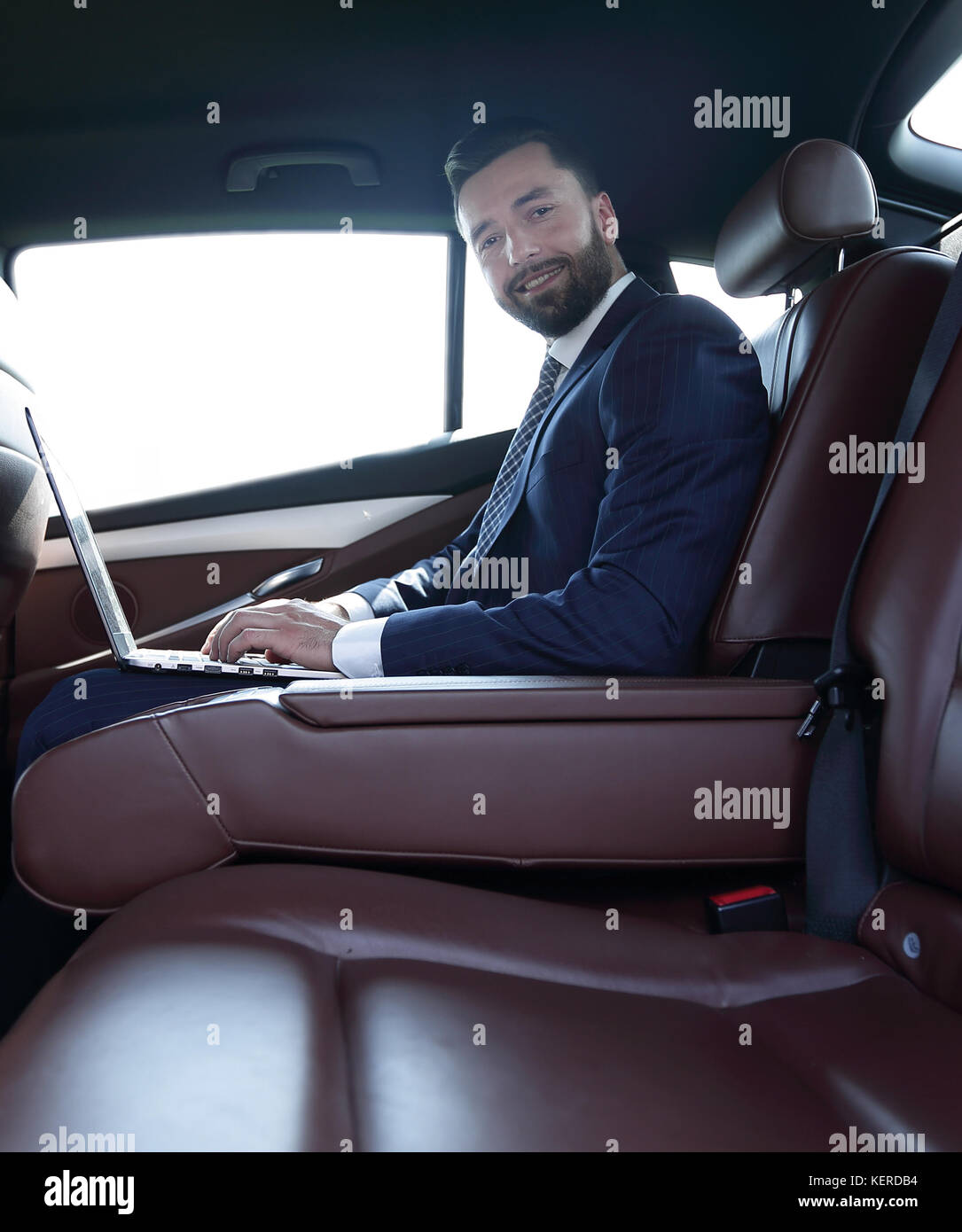 smiling businessman sitting in the back seat of a prestigious car Stock ...