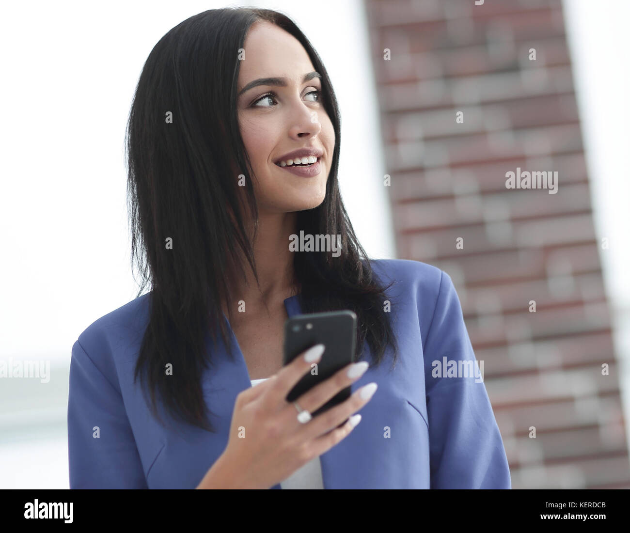 Portrait of a woman using a cell phone Stock Photo - Alamy
