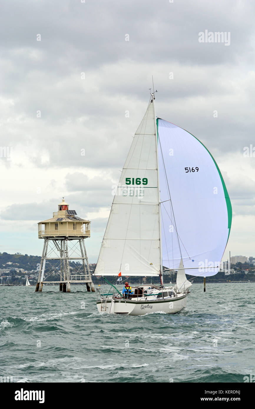 Marauder 24 yacht with spinnaker set sailing past Bean Rock lighthouse ...