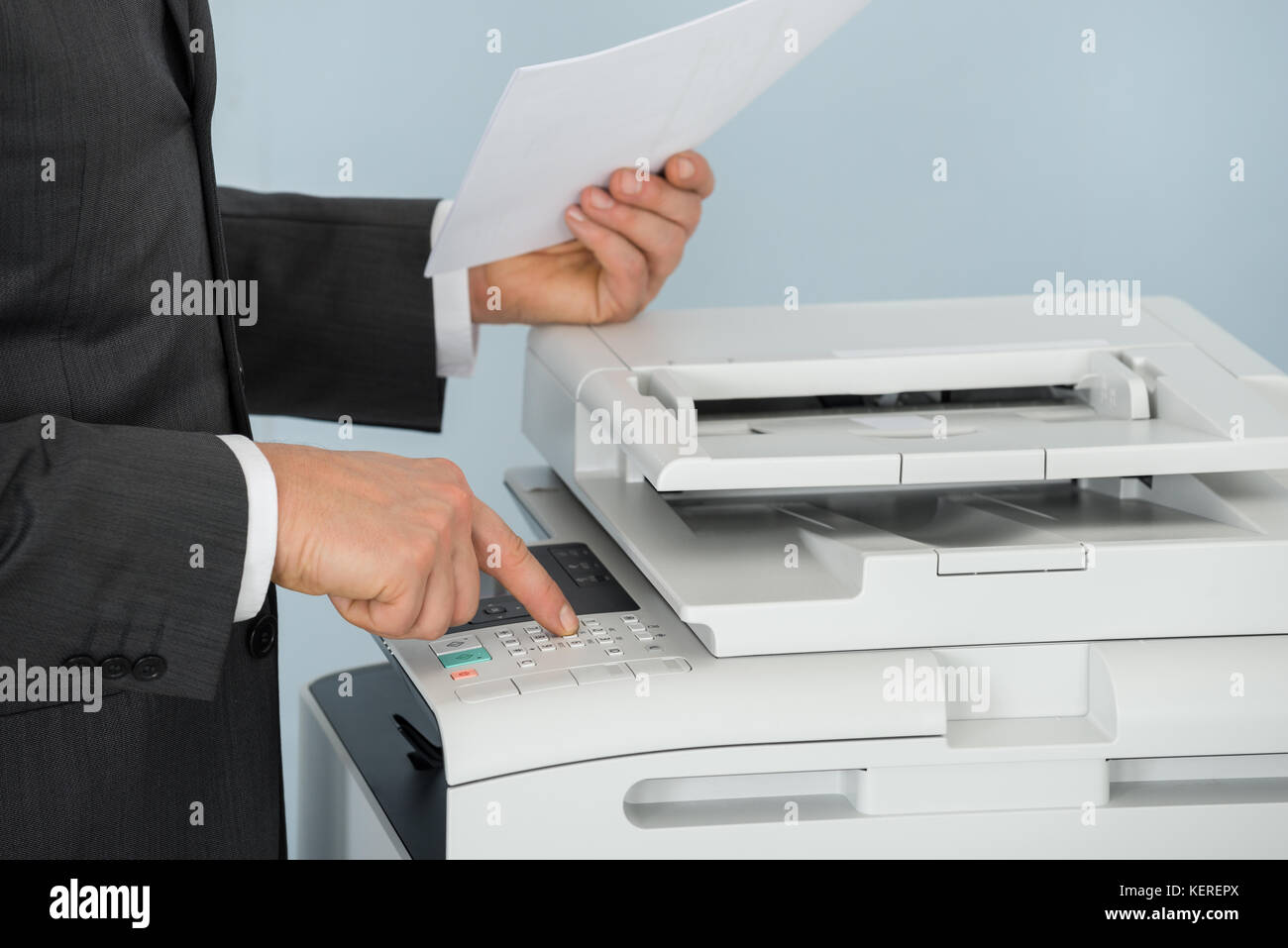 Close-up Of Businessman Hand Pressing Printer's Button In Office Stock ...