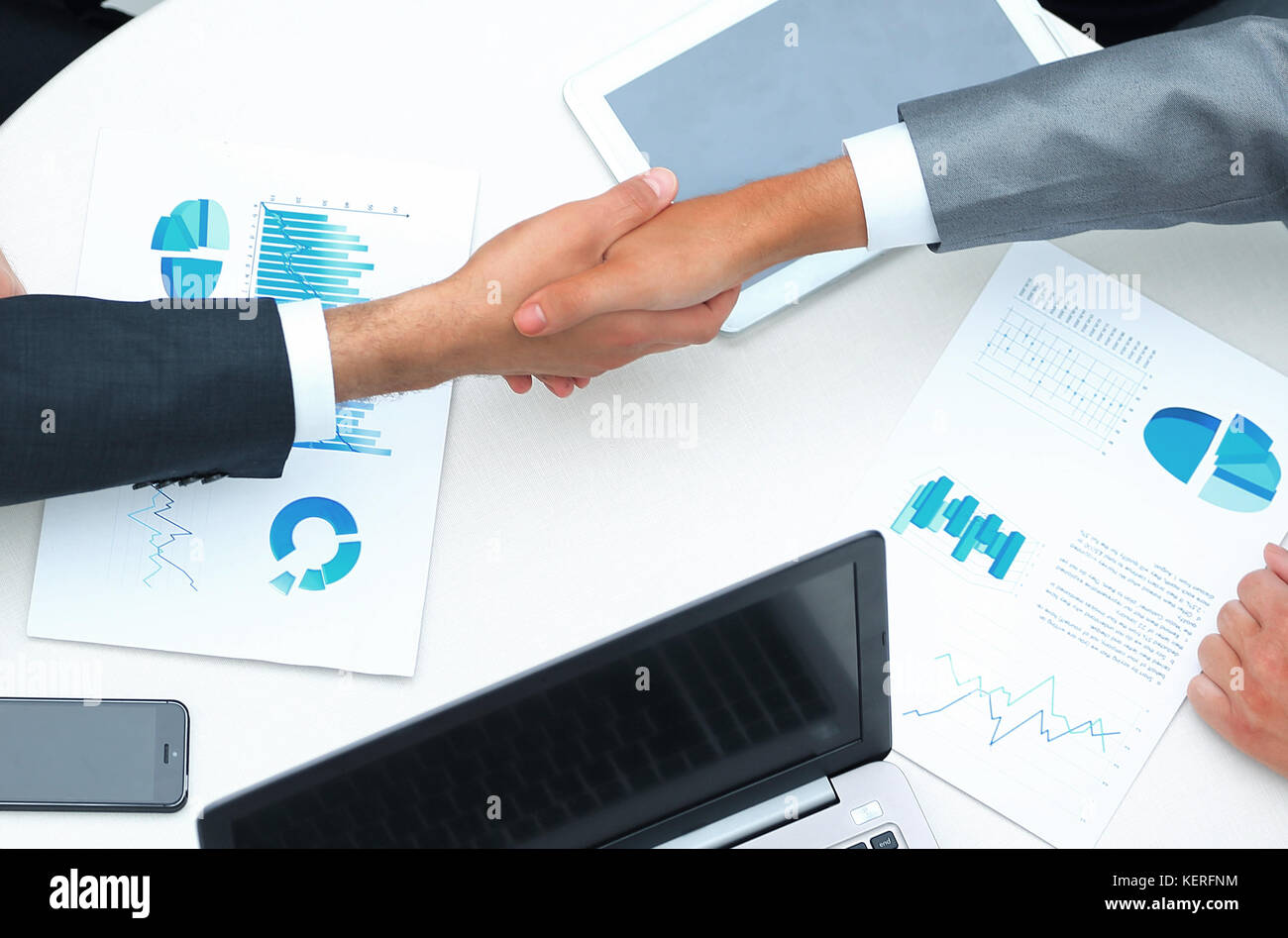 Businessmen shaking hands. Top View Stock Photo - Alamy